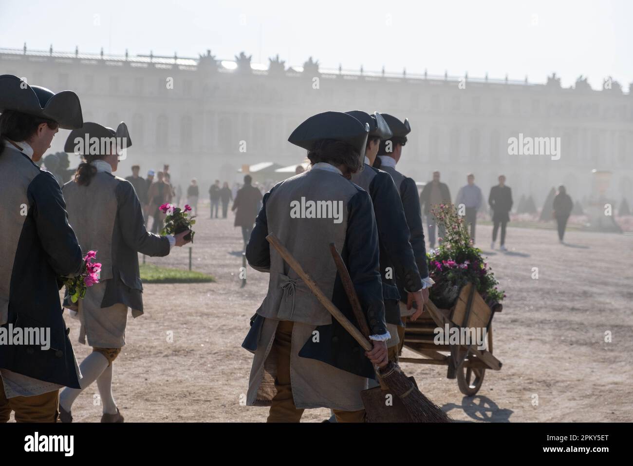 Victorian Era France: Male Servants in Elegant Attire Holding Flowers ...
