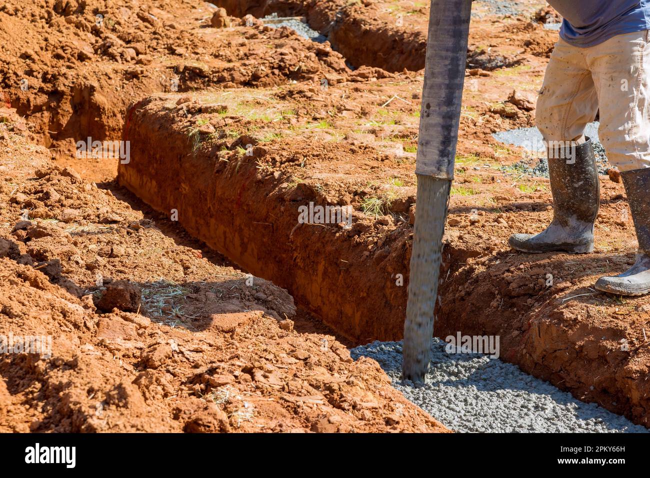 Pouring cement concrete with assistance of an automatic pump to lay ...