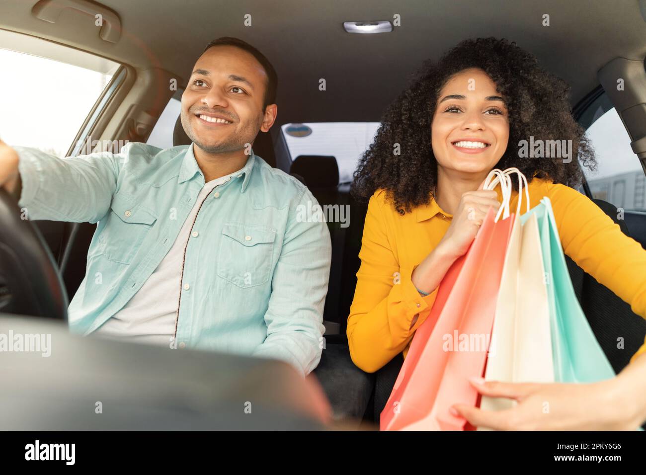 Positive Middle Eastern Shopaholics Couple Driving Car After Weekend ...