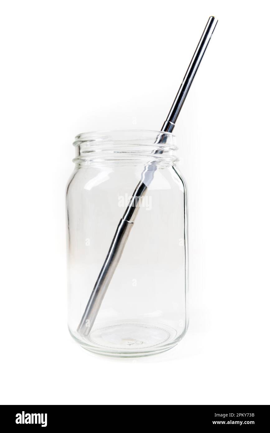 Reusable extending straw in a glass jar over white Stock Photo - Alamy