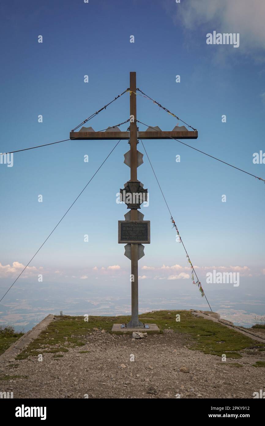 The blue sky over Peak Cross at Hochobir Mountain in Hochobir, Kaernten ...