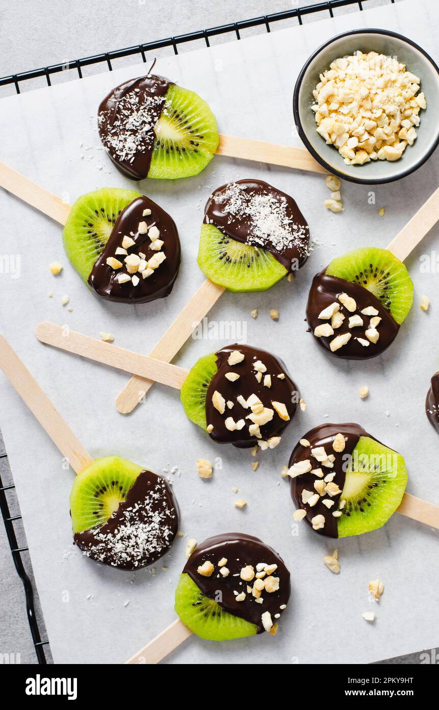 Kiwi Slices Coved In Chocolate with Shredded Coconut and Nuts, Healthy ...