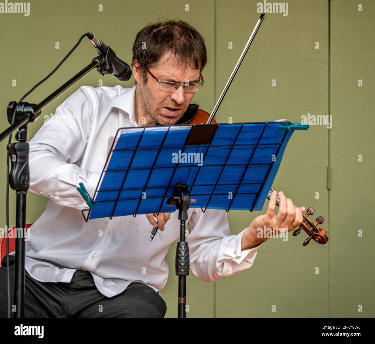 Outdoor classical recital by string trio Stock Photo - Alamy