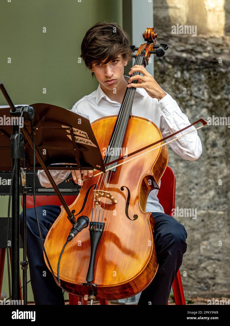 Outdoor classical recital by string trio Stock Photo - Alamy