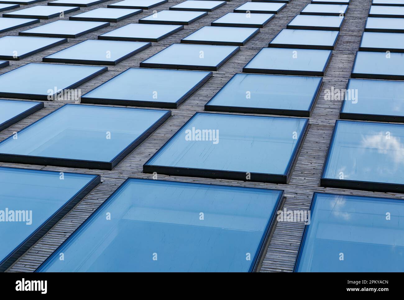 Looking up at 1 John Street: Concrete panel and glass curtain wall ...