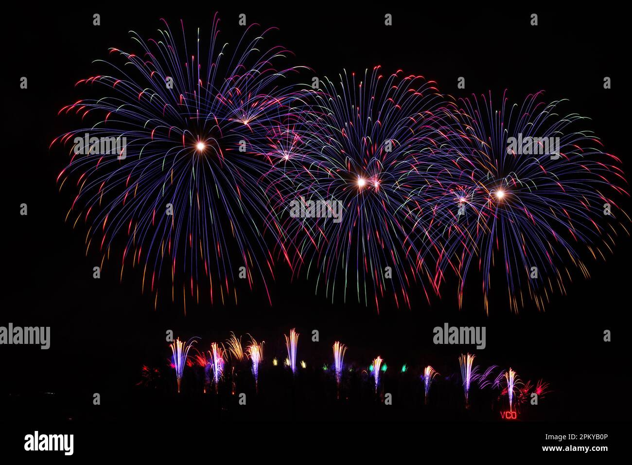 A night-time scene featuring a stunning display of colorful fireworks ...
