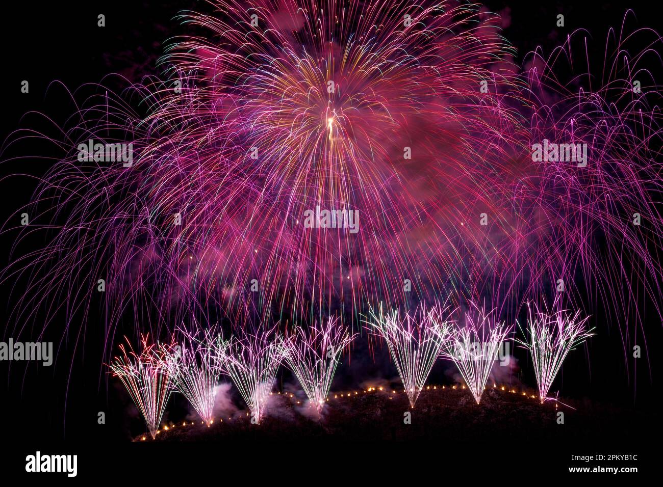 A night-time scene featuring a stunning display of colorful fireworks ...