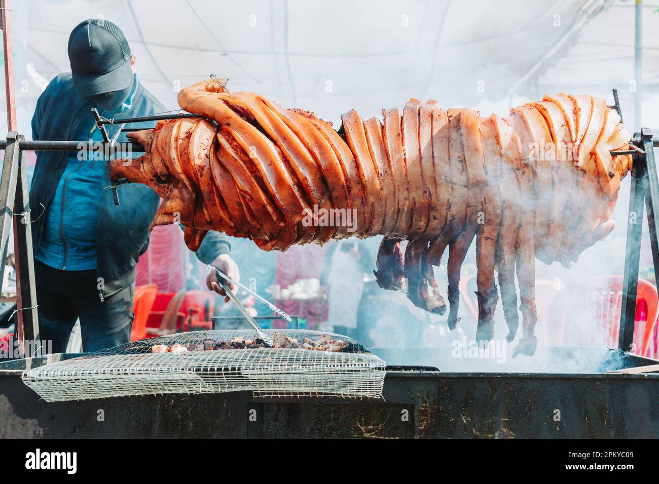 Whole Pork barbeque on a charcoal grill outdoor Stock Photo - Alamy