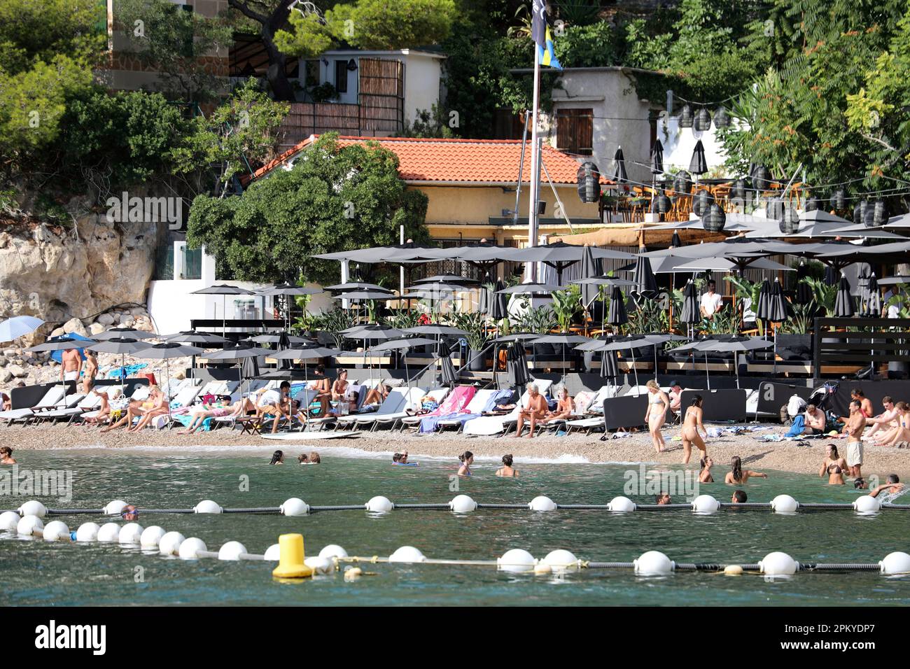 Cap-d'Ail, France - September 5, 2022: Tourists unwind on the ...
