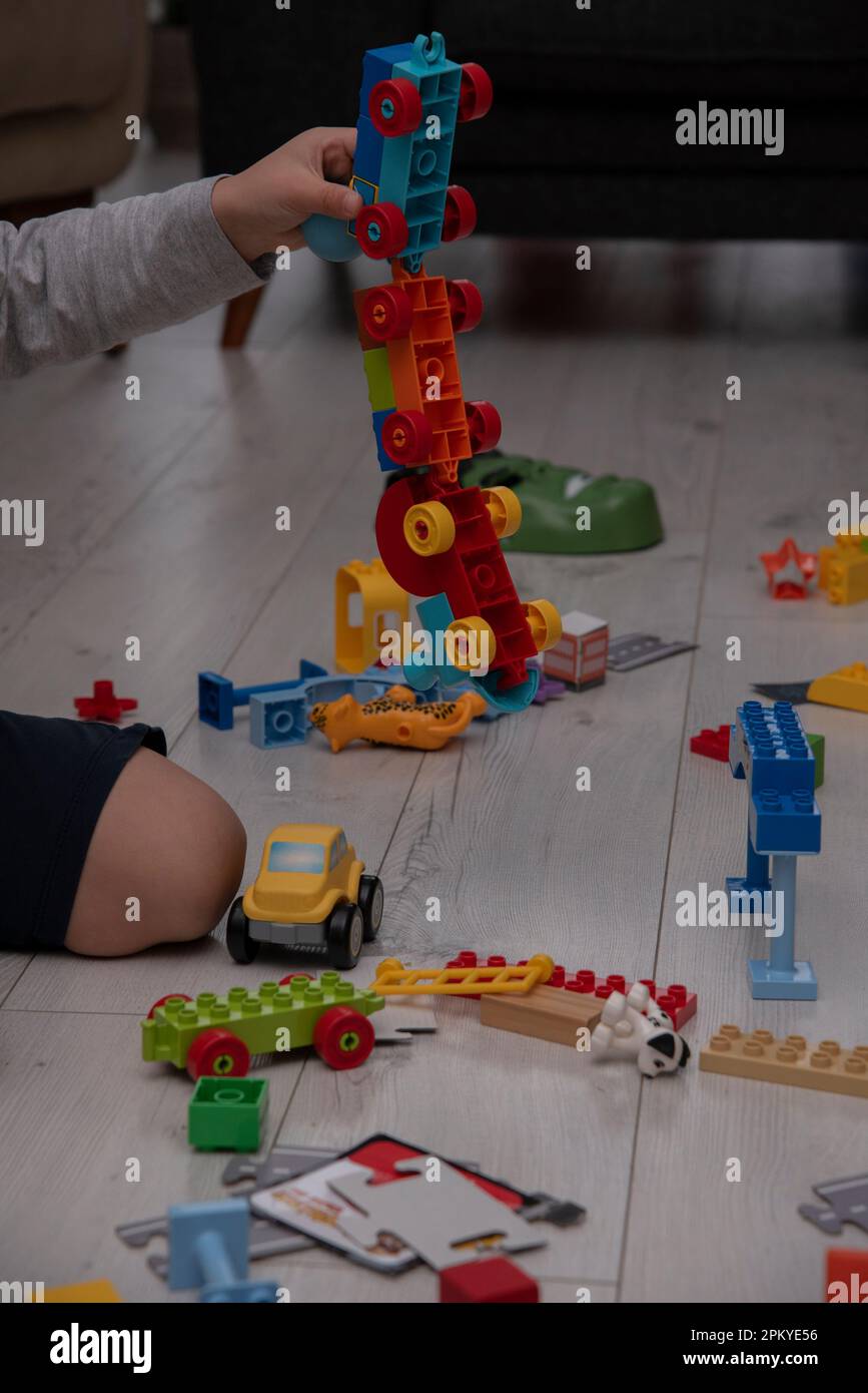 Child hands play with colorful lego Stock Photo - Alamy