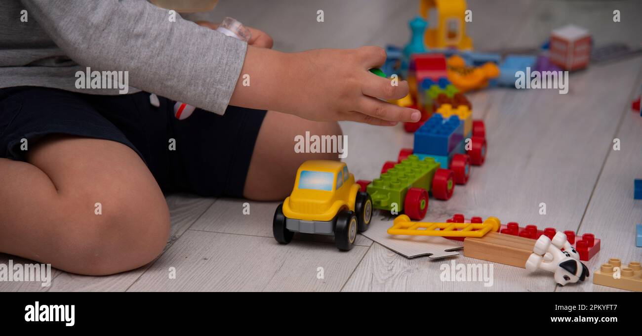 Child hands play with colorful bricks Stock Photo - Alamy