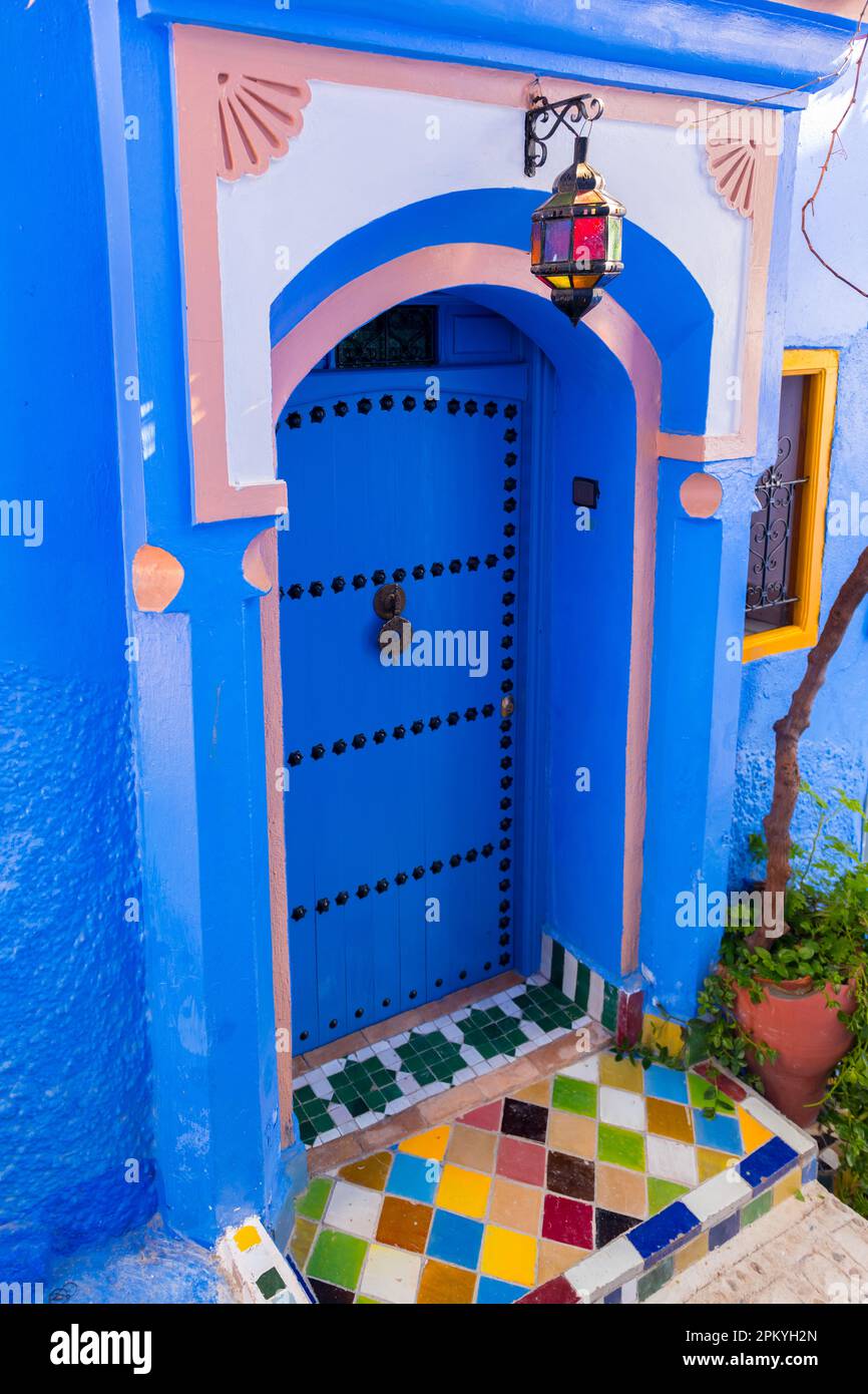 Blue entrance door, entrance floor decorated with different colored ...