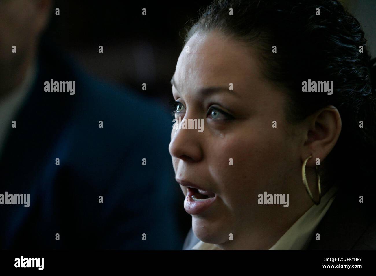 Delgado's tears run down her face during the press conference. Edith ...