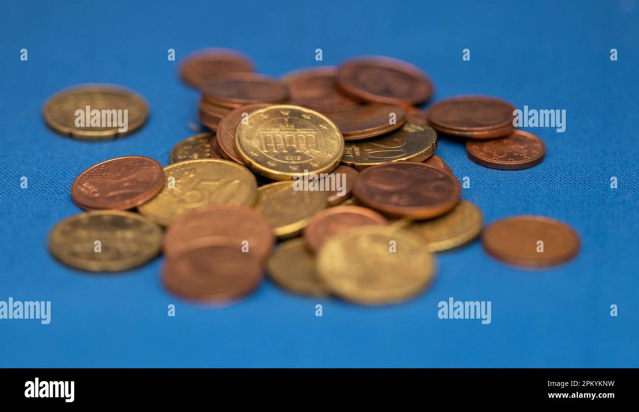 An arrangement of coins in a stack on a flat surface Stock Photo - Alamy
