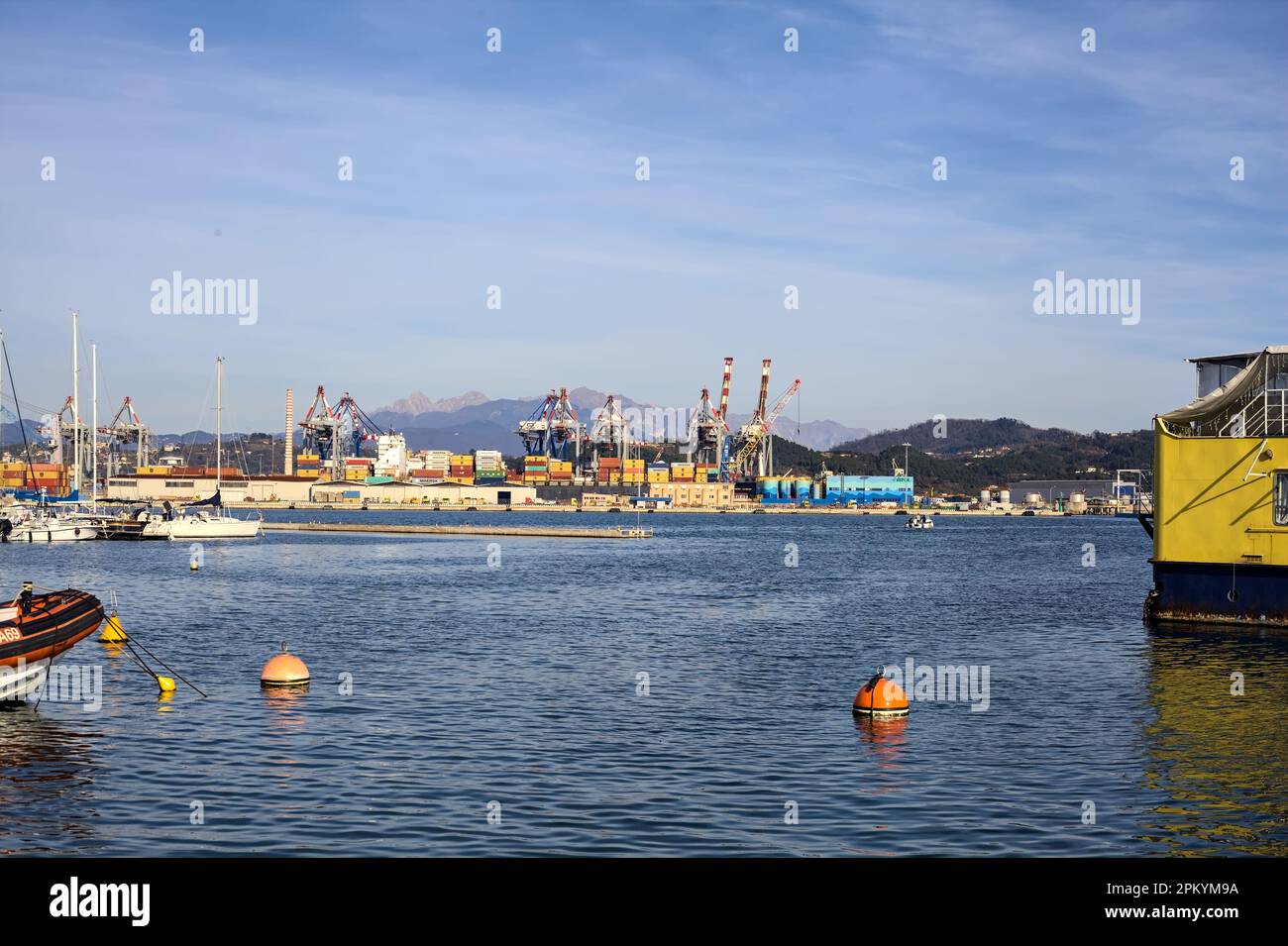 Freight yard and an industrial complex in a harbour at sunset seen from ...