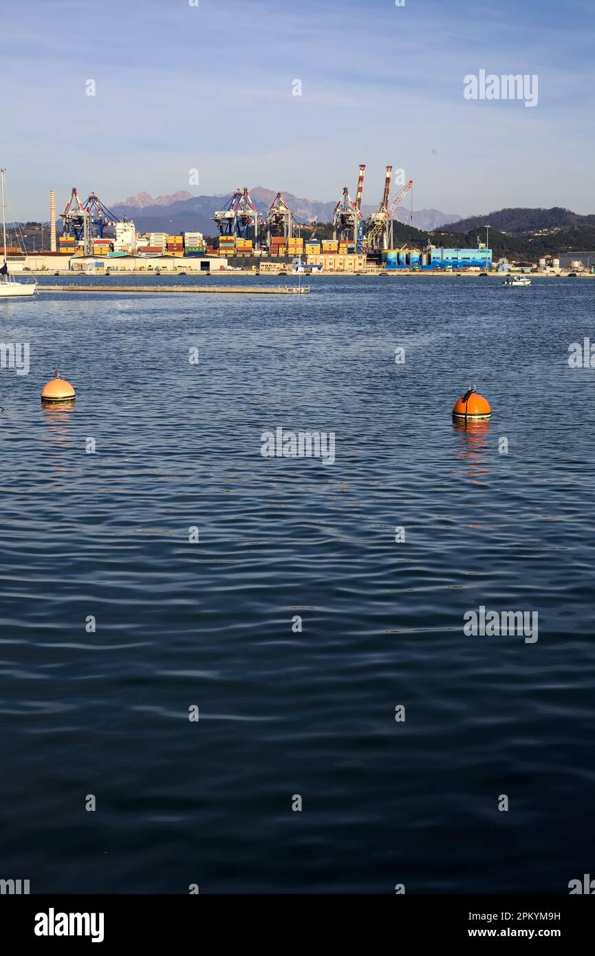 Freight yard and an industrial complex in a harbour at sunset seen from ...