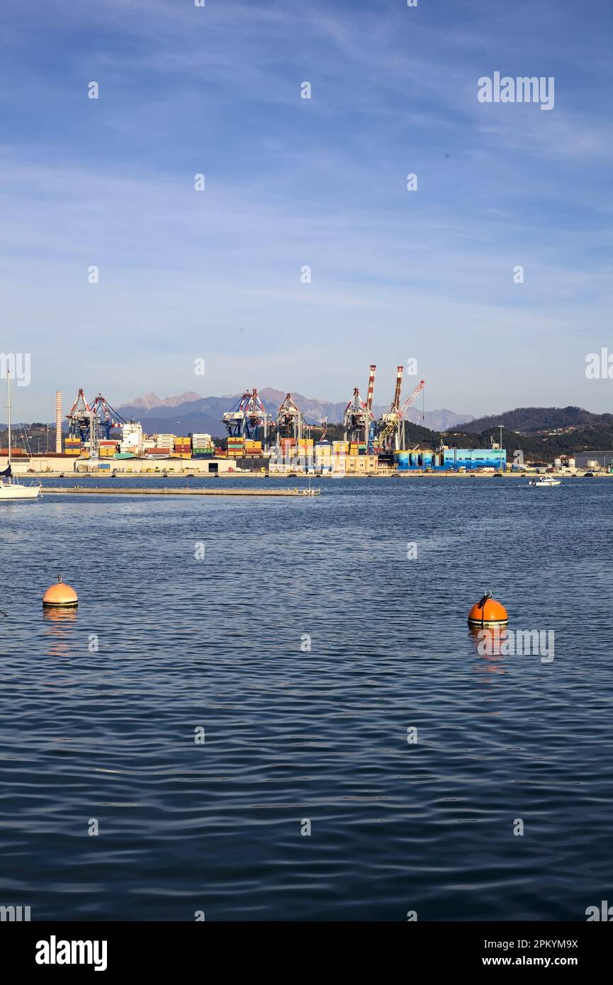 Freight yard and an industrial complex in a harbour at sunset seen from ...