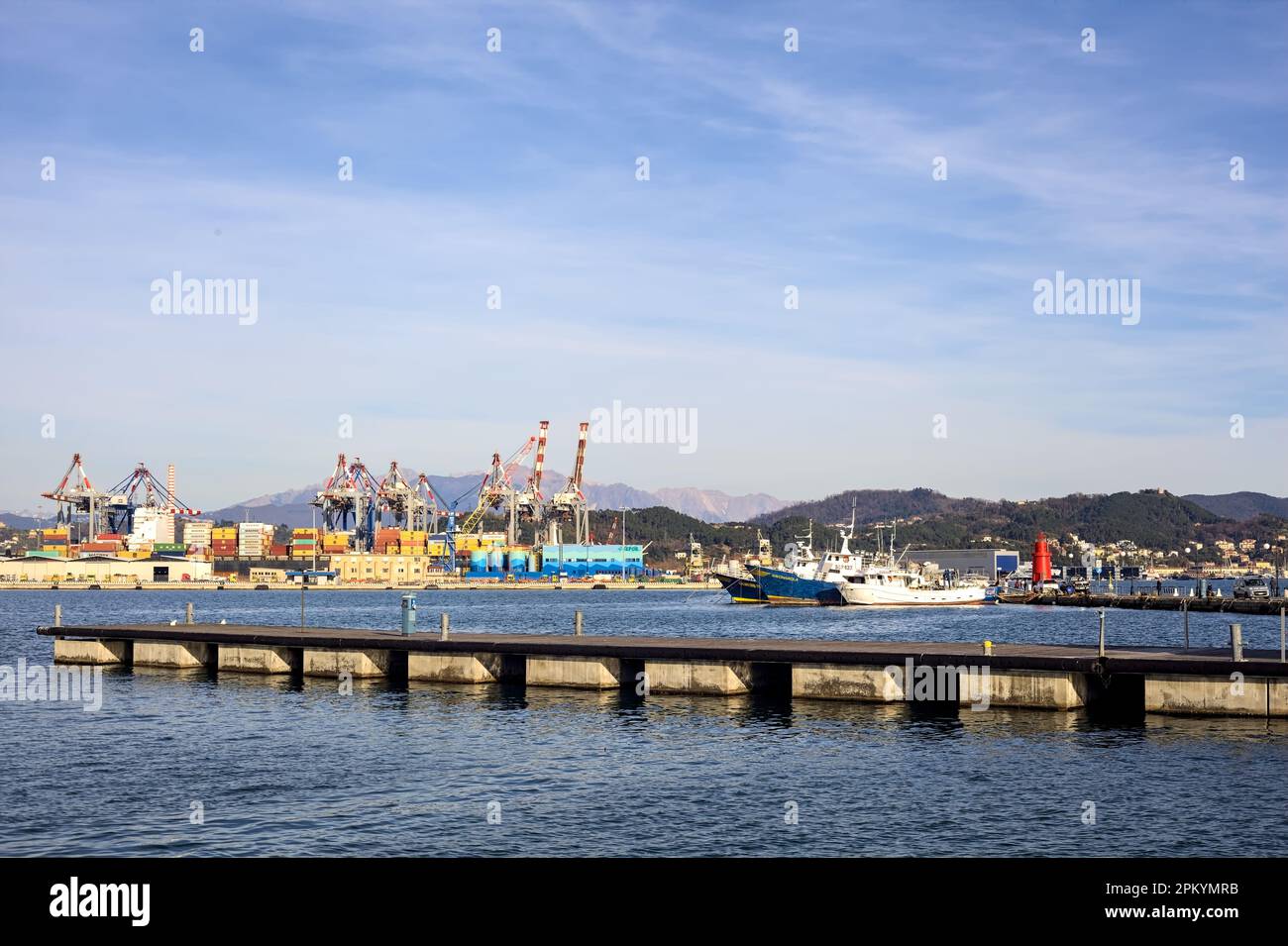 Freight yard and an industrial complex in a bay at sunset seen from the ...