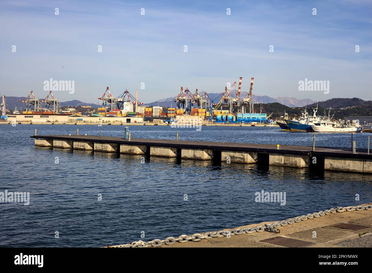 Freight yard and an industrial complex in a bay at sunset seen from the ...