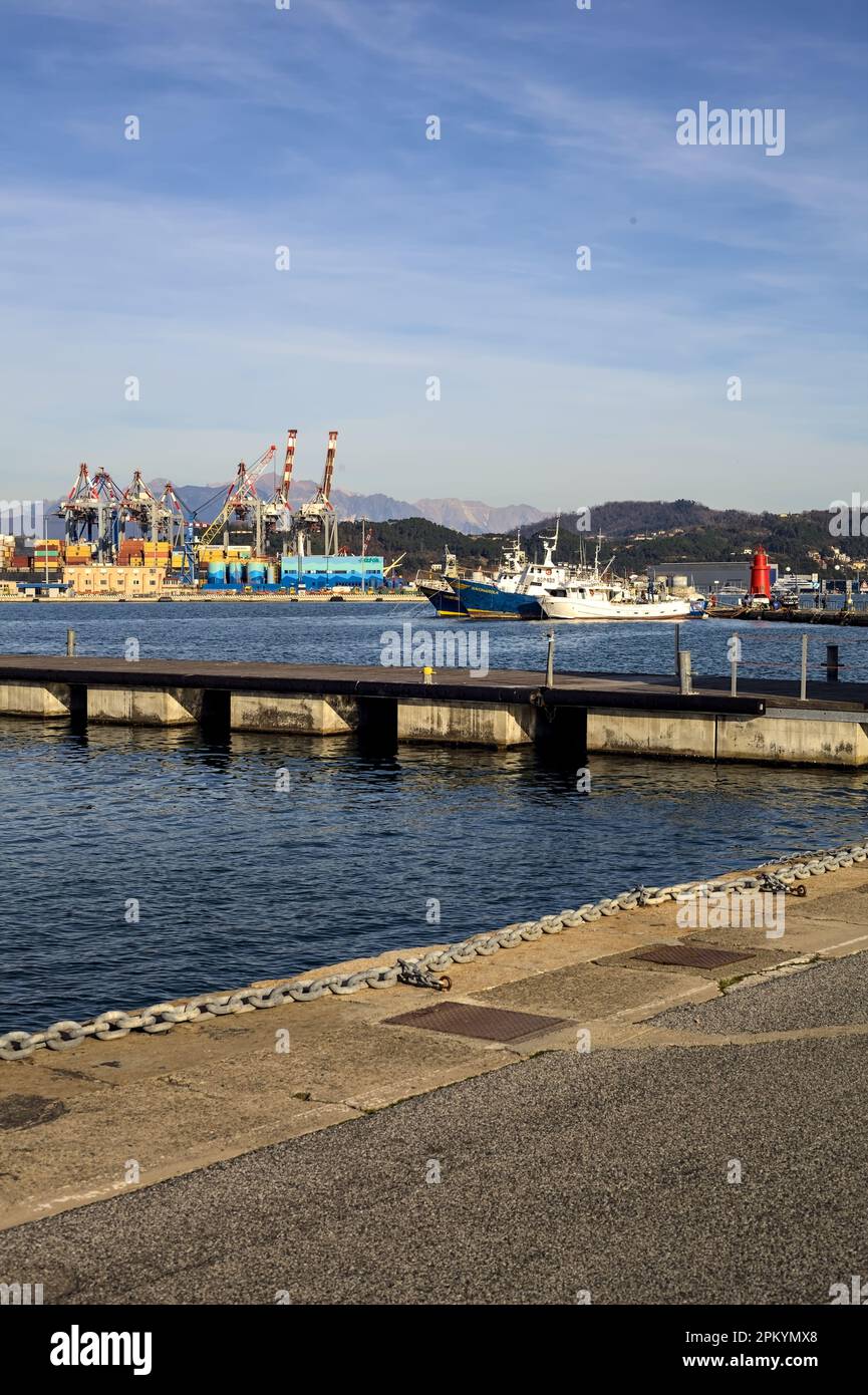 Freight yard and an industrial complex in a bay at sunset seen from the ...