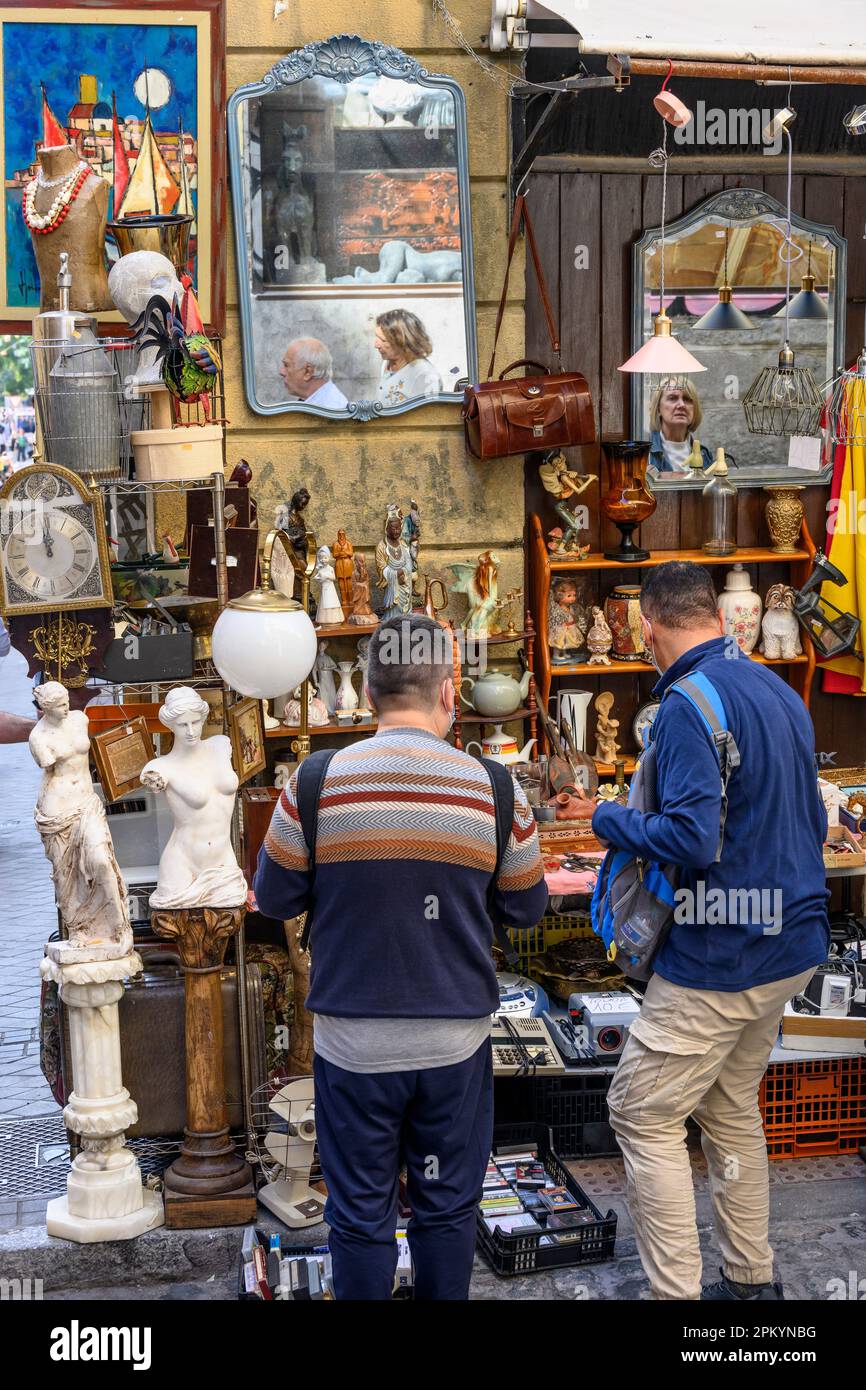 Antiques and bric-a-brac on sale in the Rastro flea market around the ...