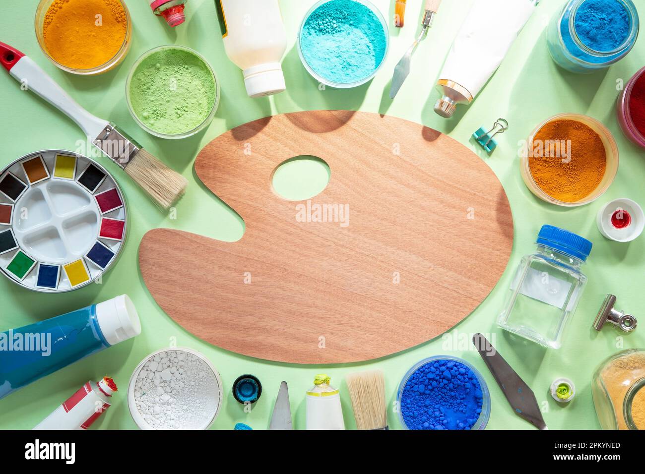 Painting equipment on green background - top view Stock Photo - Alamy