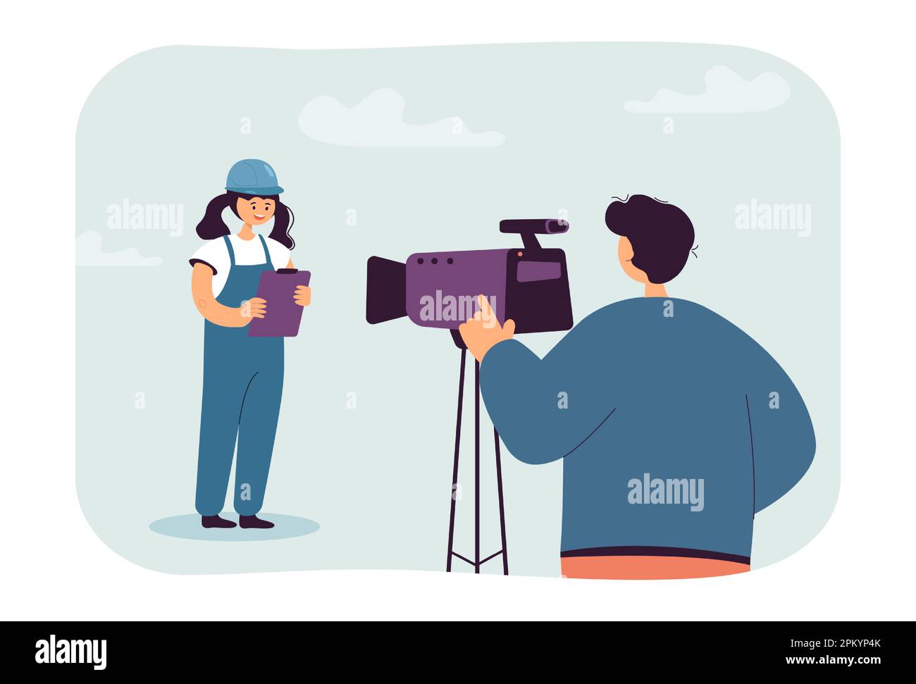 Back view of cameraman filming little girl in builder costume Stock ...