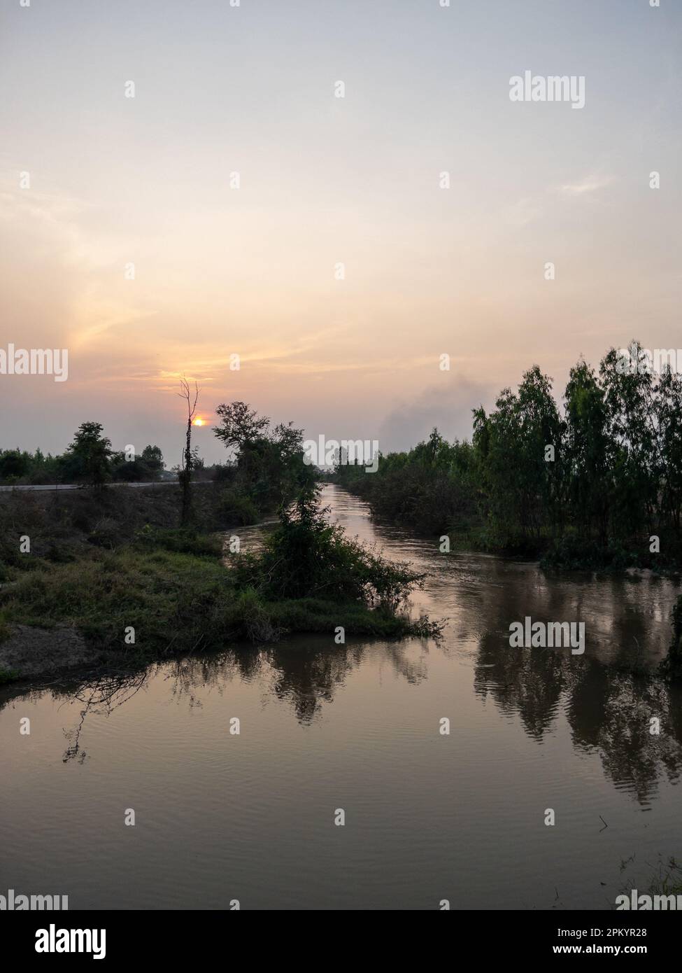 The stream flowing in the canal for irrigation which is along the road ...