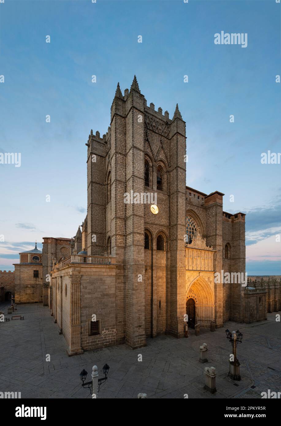 Exterior of aged historic Avila cathedral with brick walls and arched ...