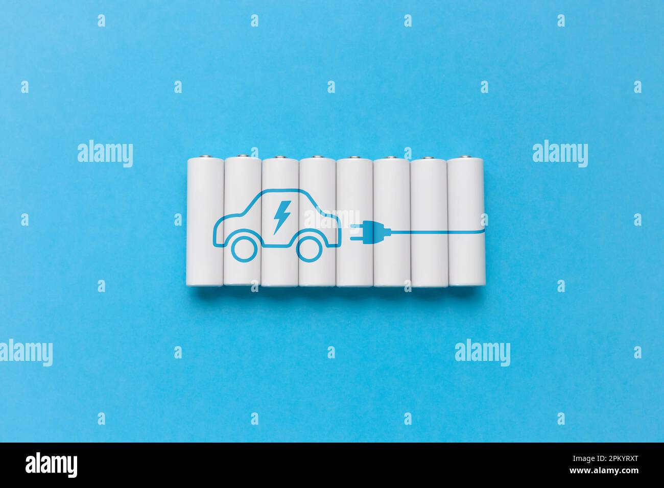 Top view of row with many white electric car batteries on blue ...