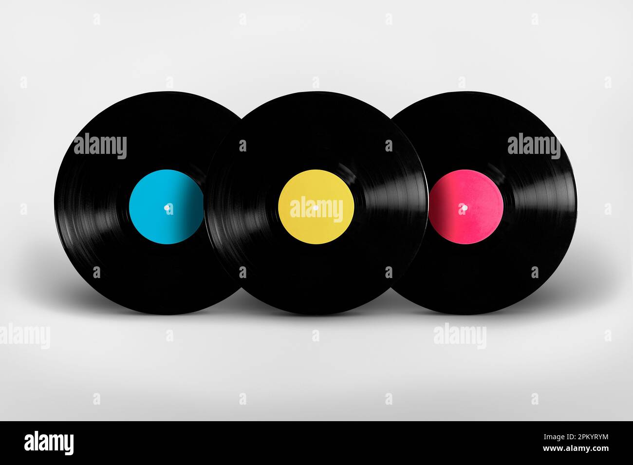 Round shaped vinyl records with colorful circles in row on white background with shadow Stock ...