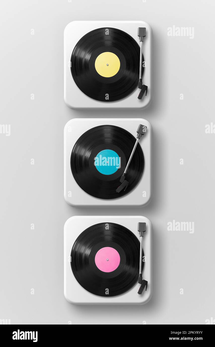 Top view of modern turntables with black colored vinyl records on white ...
