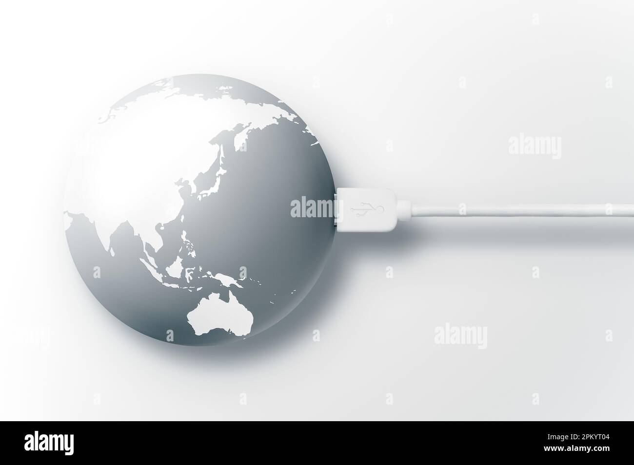 Round shaped globe world map connected by digital USB cable and placed ...