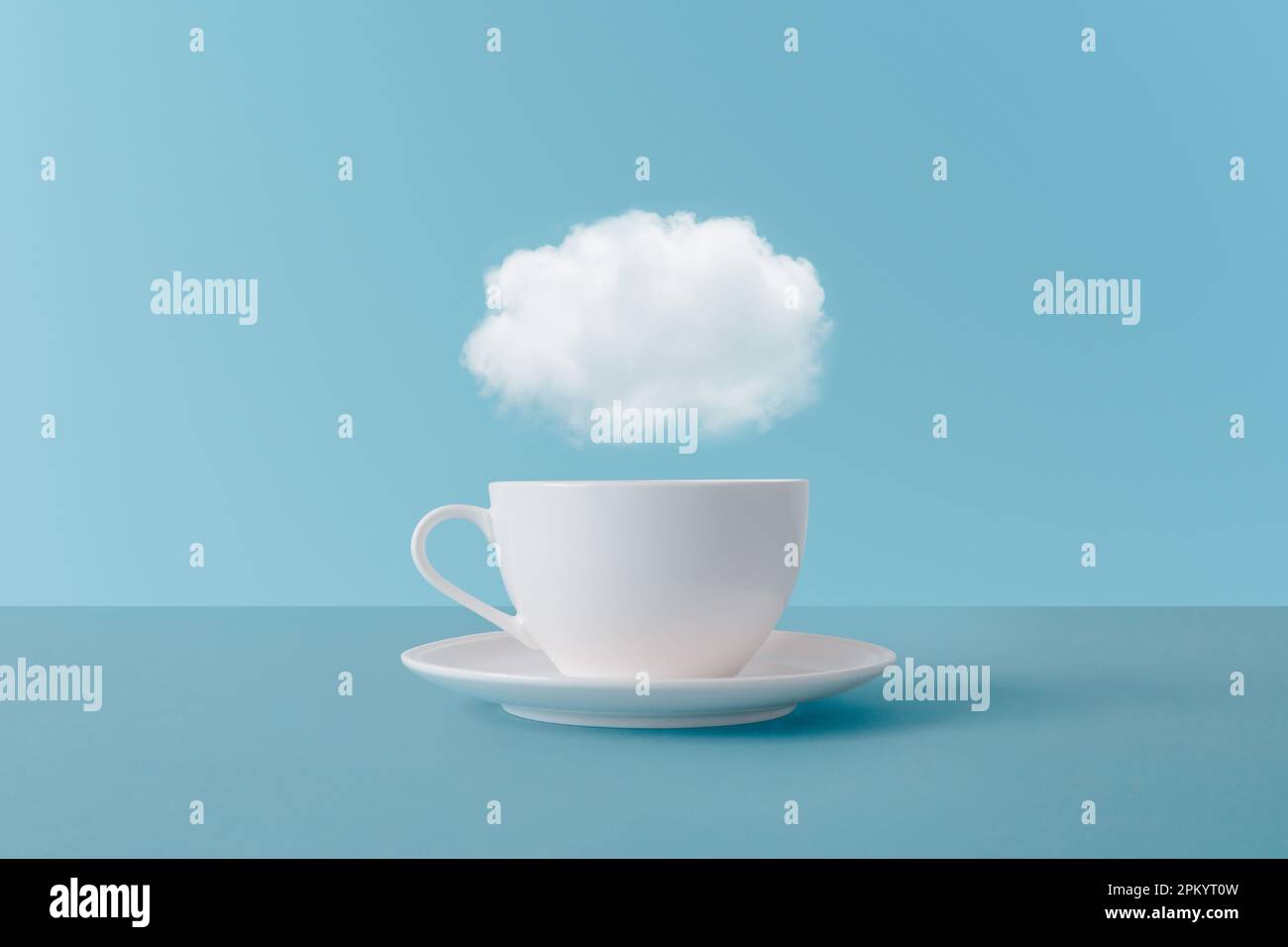 Cloud floating above white ceramic cup of aromatic drink representing ...