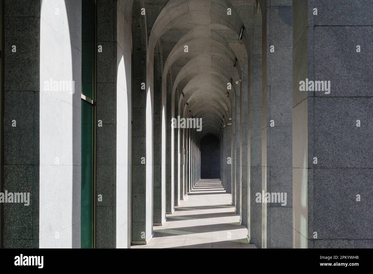 Corridor with rows of columns in sunlight Stock Photo - Alamy