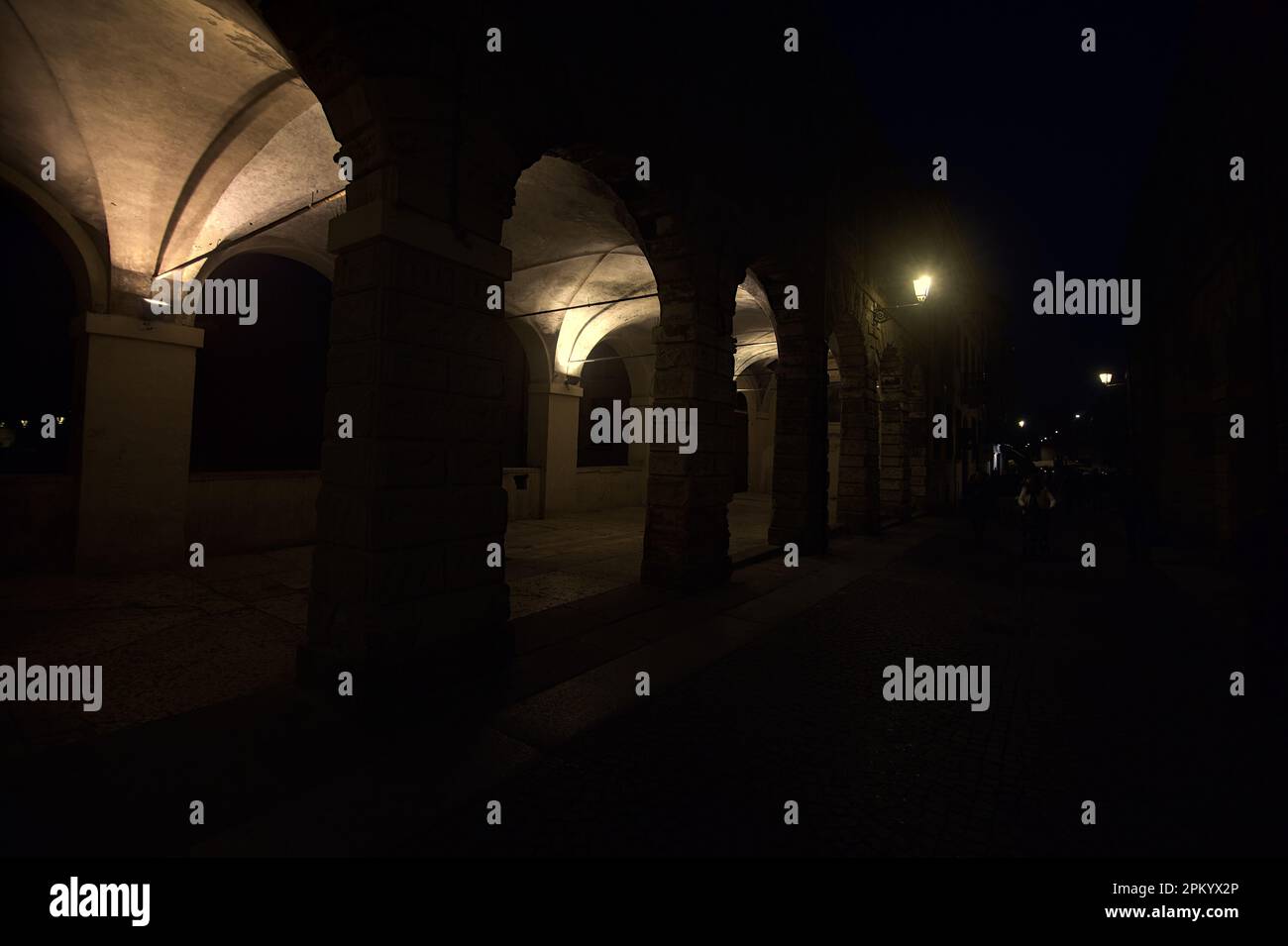 Porch under a buidling at night with street light in it Stock Photo - Alamy