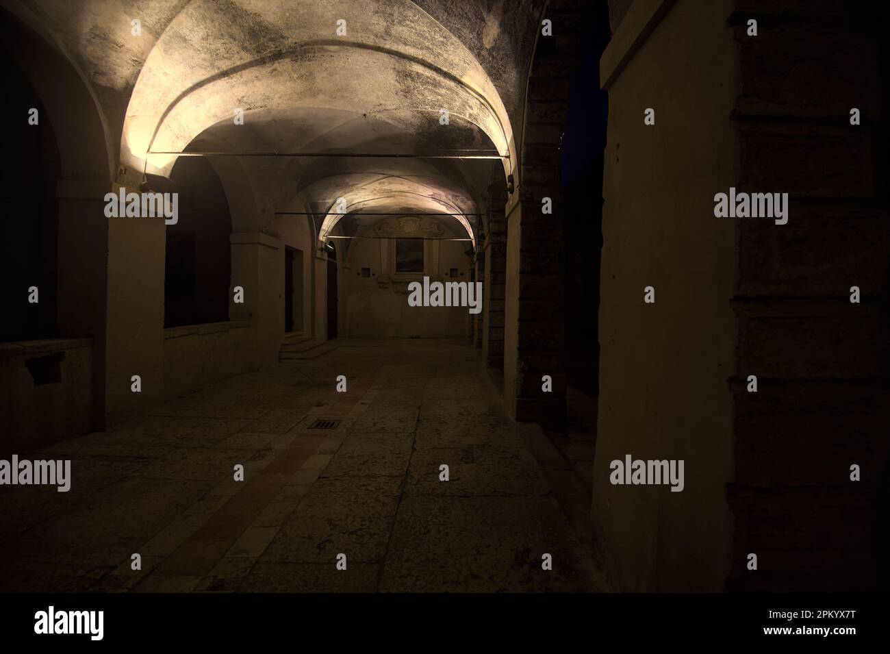 Porch under a buidling at night with street light in it Stock Photo - Alamy