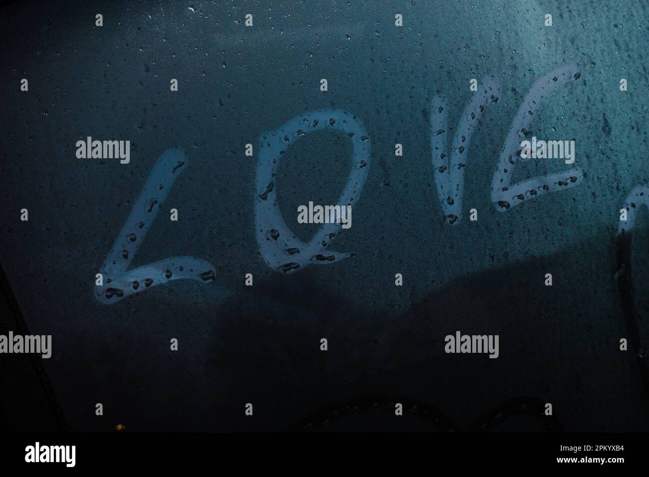 Love title and symbol of heart on car window Stock Photo - Alamy