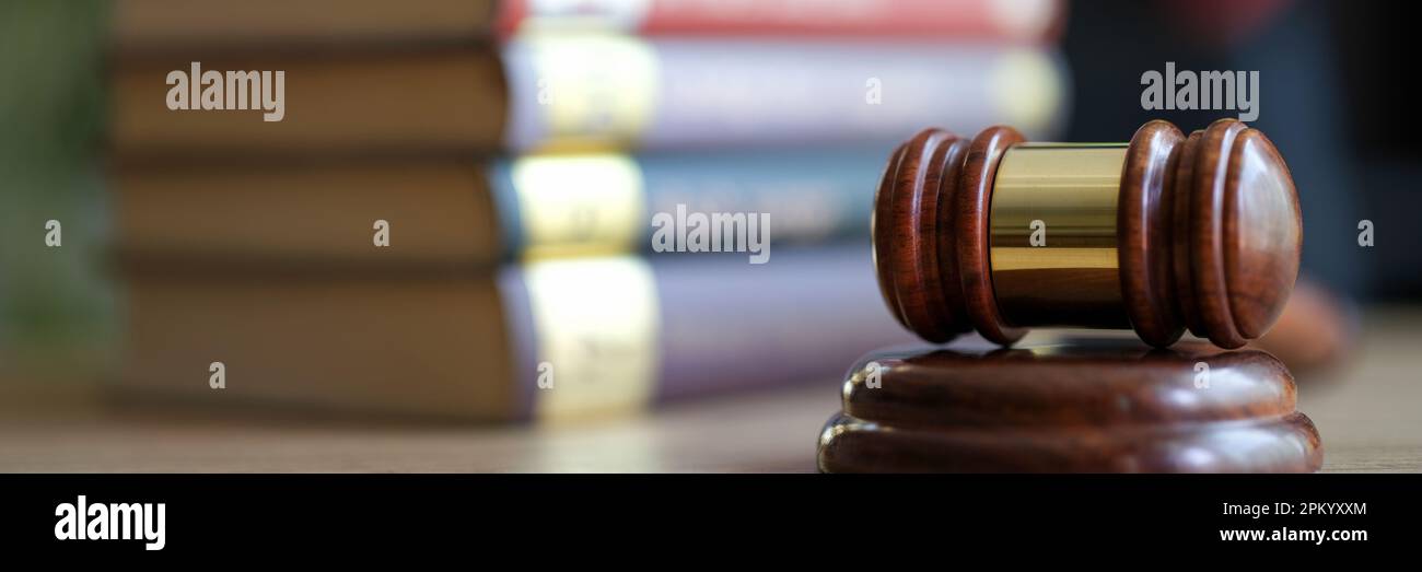 Wooden judge gavel with golden strip on sounding block Stock Photo - Alamy