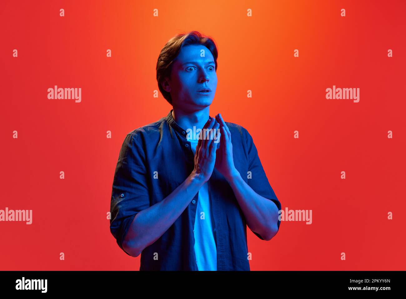 Portrait of young funky guy, man wearing shirt standing with shocked ...