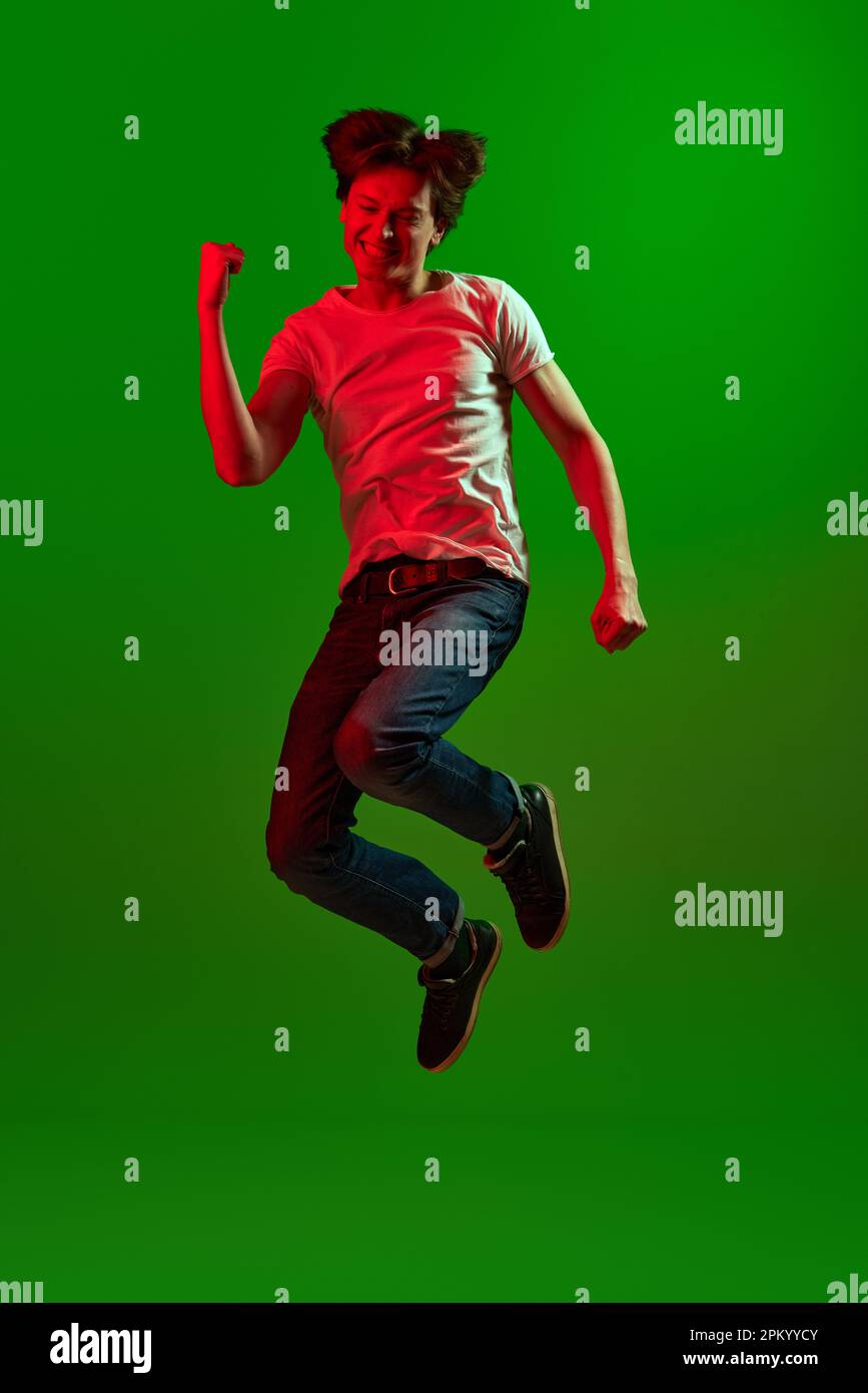 Studio shot of young guy, student screaming with exciting face and ...