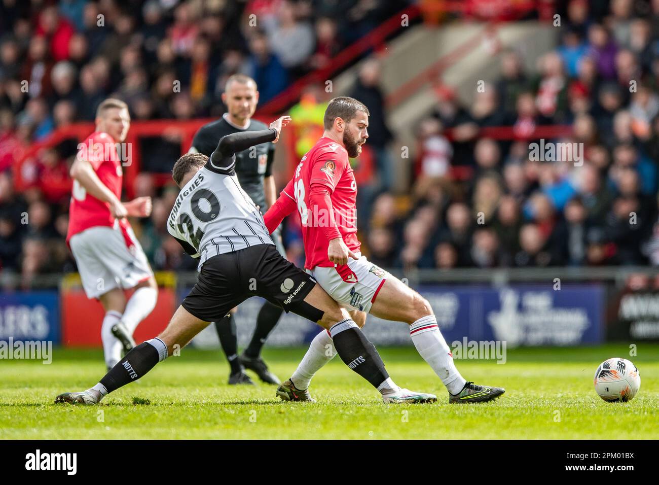 Rúben Rodrigues #20 of Notts County slides in to challenge Elliot Lee ...