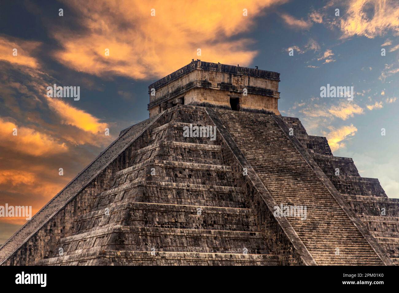 The pyramid of Chichen Itza in honor of the God Kukulkan under a ...