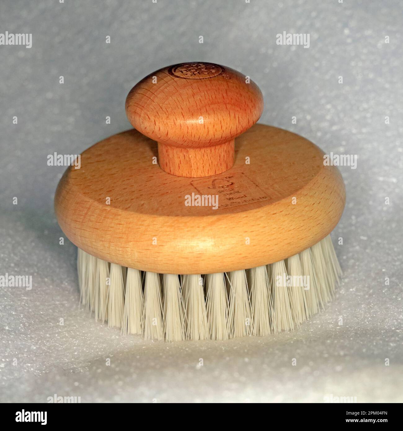 Round wooden body brush Stock Photo - Alamy