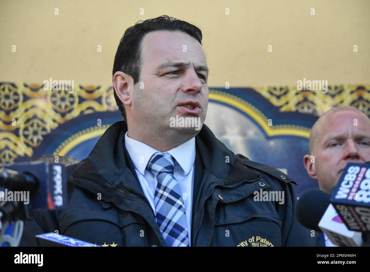 Mayor of Paterson Andre Sayegh delivers his remarks. Mayor of Paterson ...