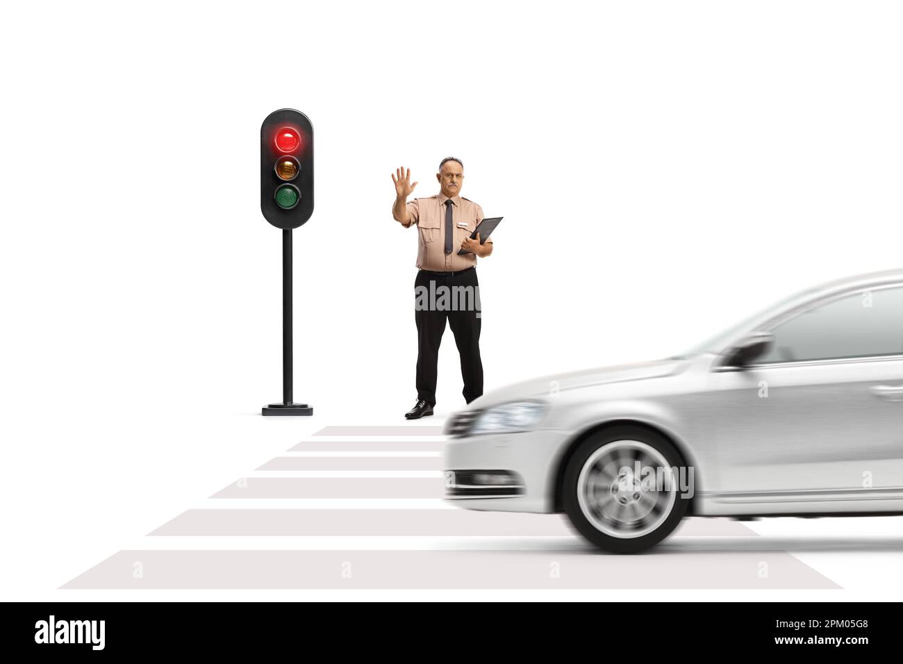 Full length portrait of a security guard gesturing stop with hand at a ...