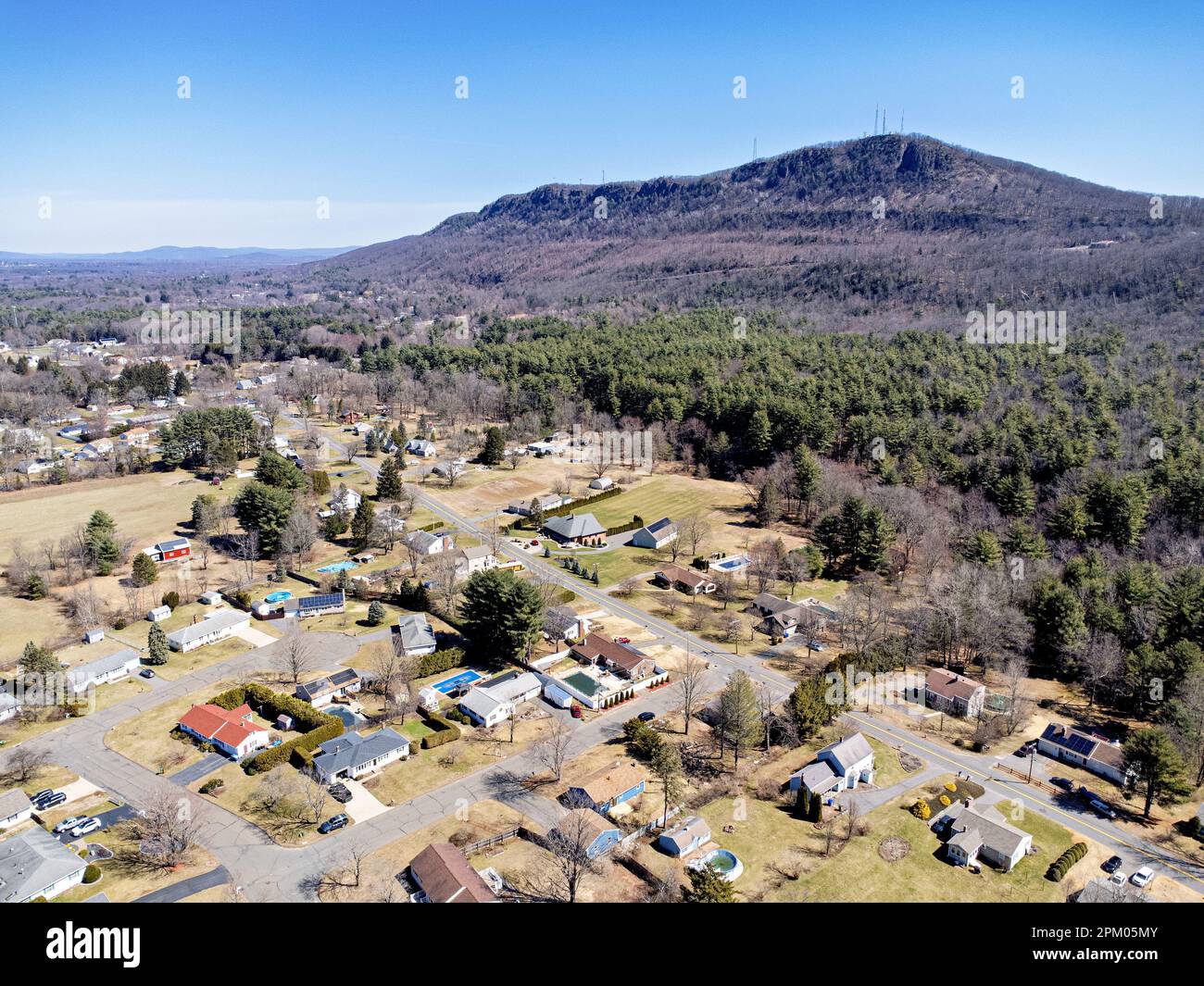 A stunning aerial view of a rural town nestled at the base of a ...
