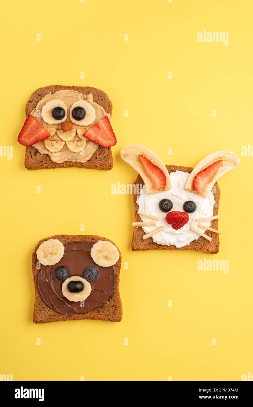 Funny animal faces toasts for kids lunch Stock Photo - Alamy