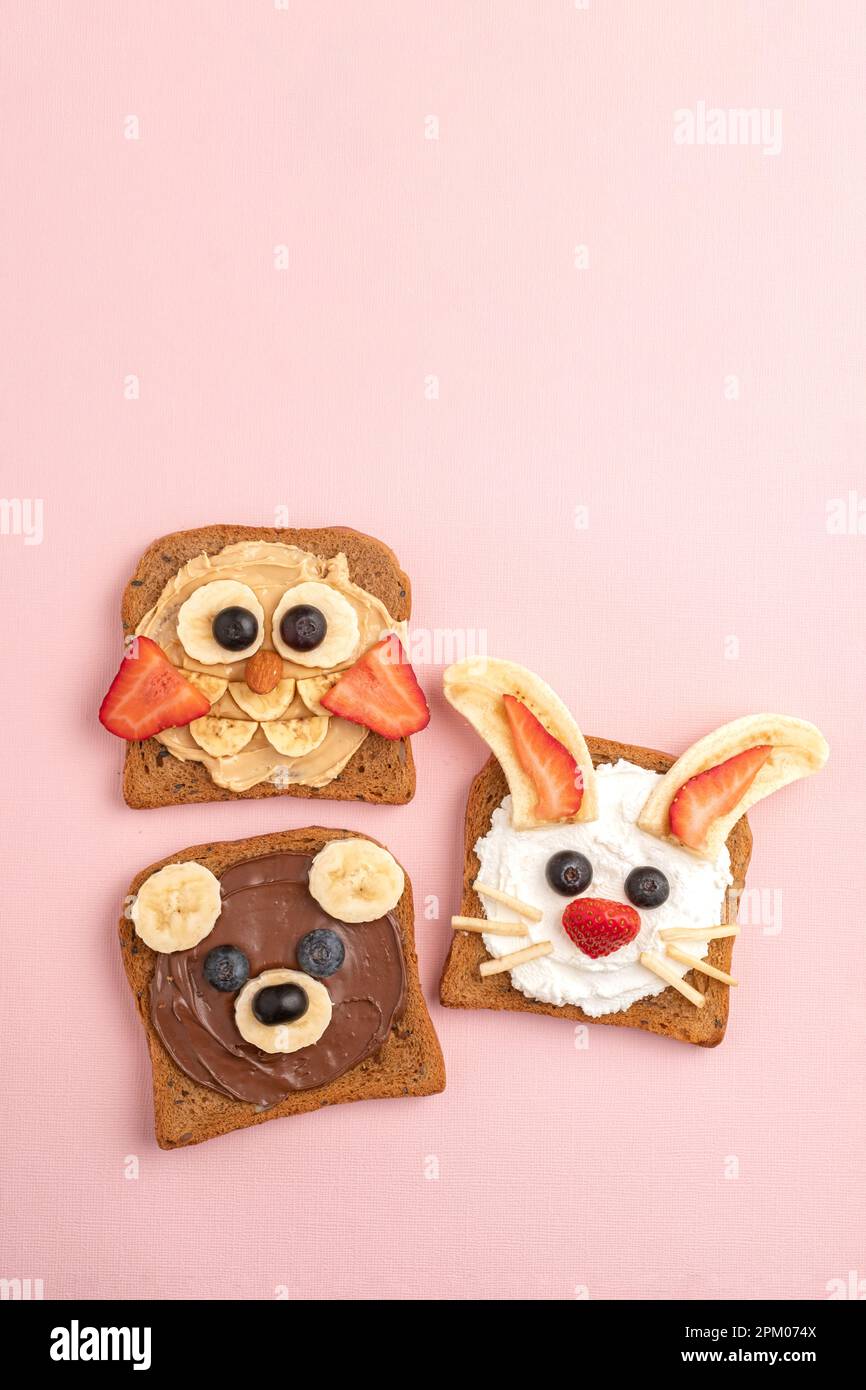 Funny animal faces toasts for kids lunch Stock Photo - Alamy
