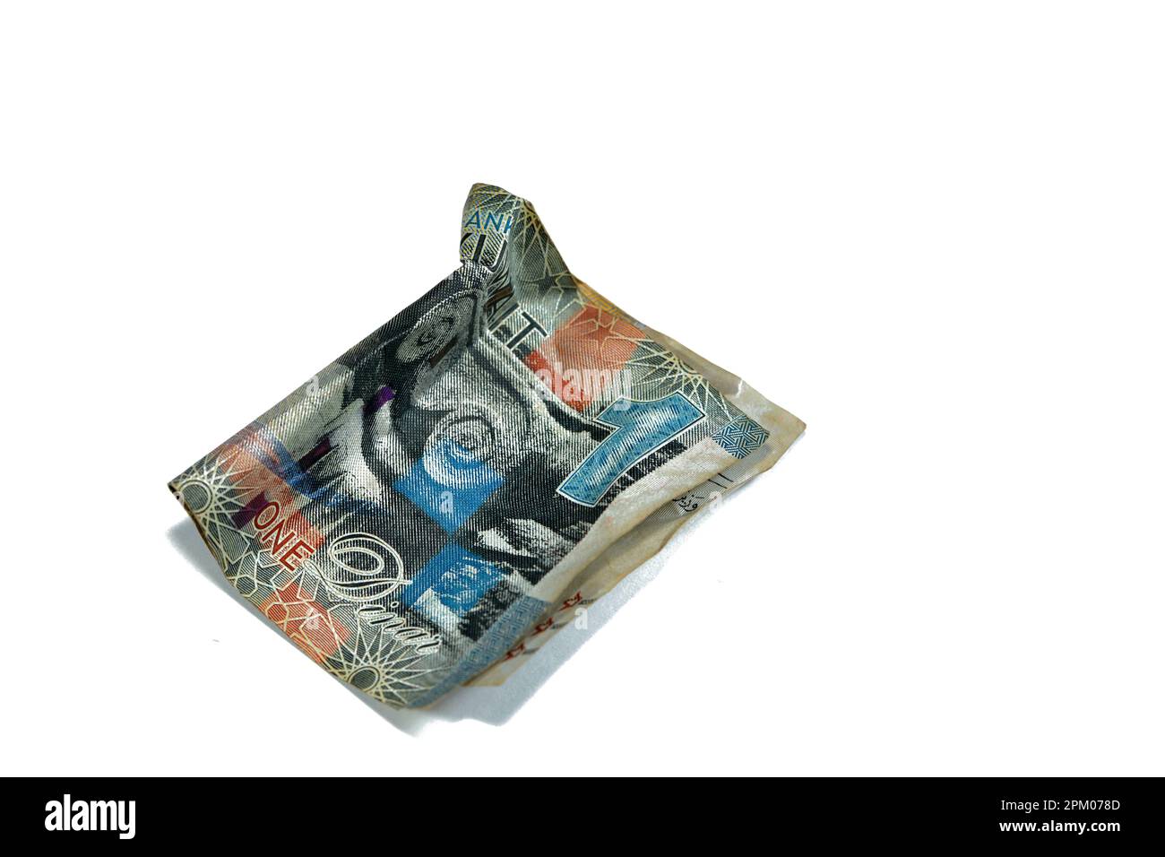 Selective focus of crumpled Kuwaiti money of 1 KWD one Kuwait dinar ...